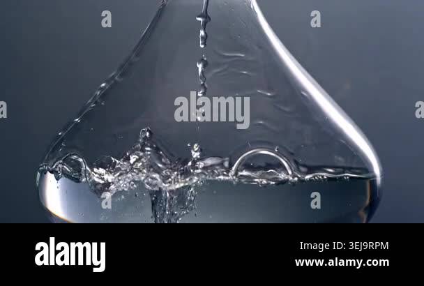 Water Drops Falling Into Transparent Liquid Macro Close Up Slow Motion ...