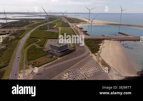Aerial view of coastal wind turbines, sandy beaches, waterways and ...