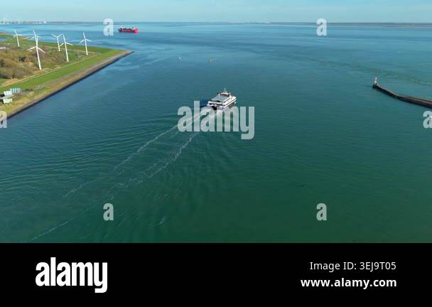 An aerial drone shot shows a passenger ferry navigating the open ...
