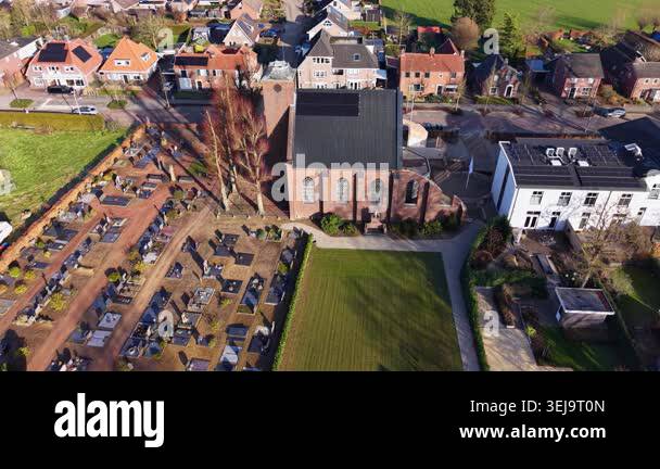 An aerial overhead view shows historic brick church and an adjacent ...
