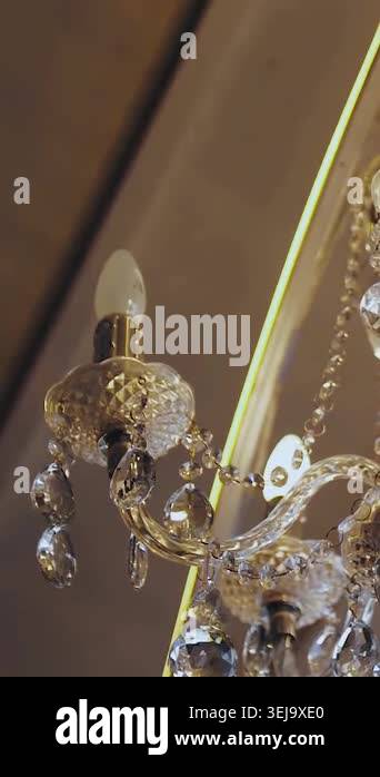 Vertical video. Close up of wedding hanging outdoor chandelier for ...