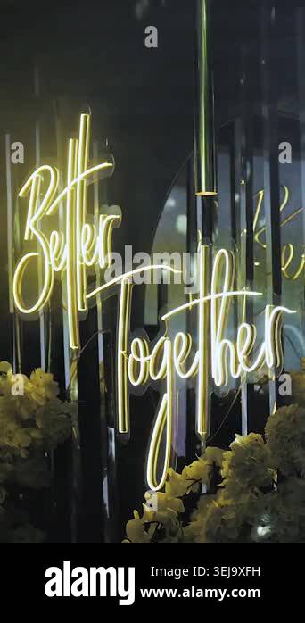 Vertical video. Better Together neon glowing wedding lettering sign ...