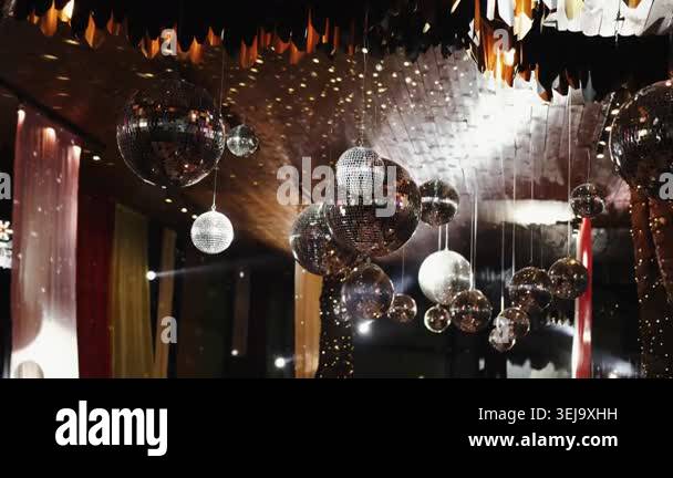 Disco balls hanging on ceiling in wedding decor for luxury party venue ...