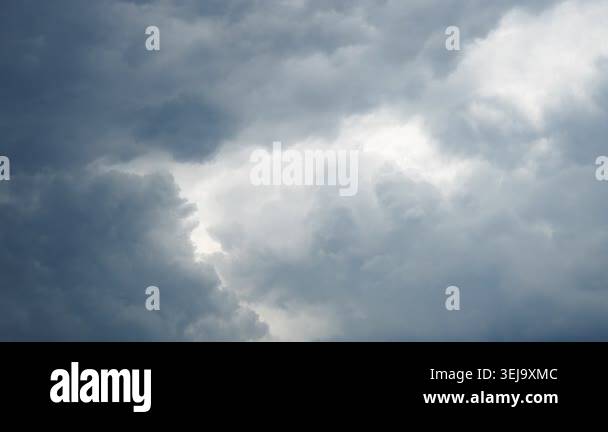 Gray clouds fill the sky as they gather thickly. The storm approaches ...