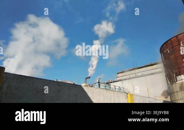Smoke and steam come out of the chimney Stock Video Footage - Alamy