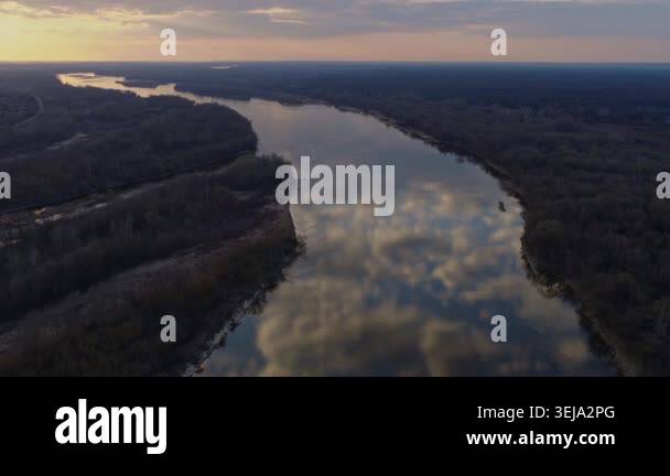 Serene aerial drone footage of the winding Vistula River near Warsaw at ...