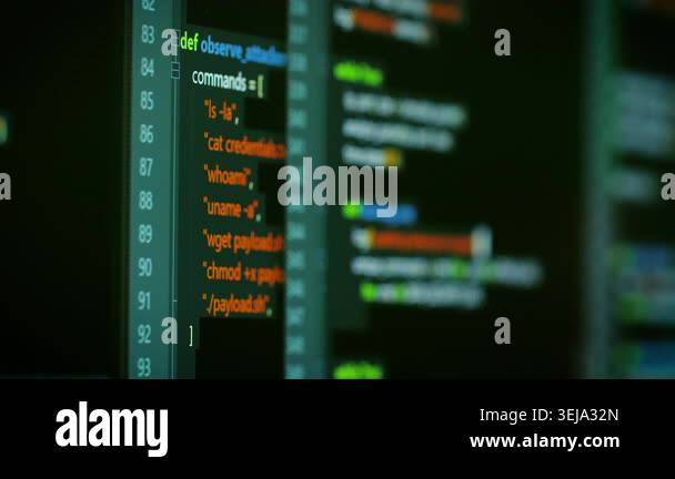 Close up computer monitors displaying fictional programming code and ...