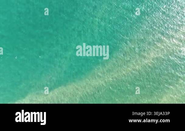 Aerial view drone footage of clear turquoise sea water ripple surface ...