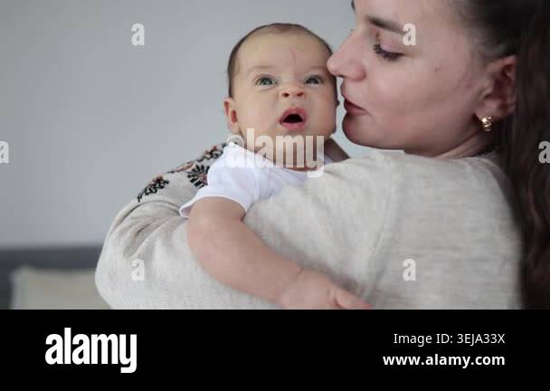 Mother soothes infant with affection before sleep, Calm and gentle ...