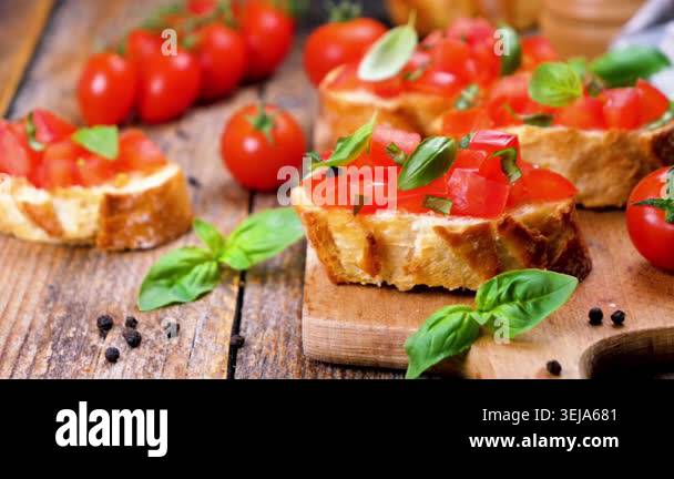 italian tomato bruschetta with fresh basil on rustic wooden cutting ...