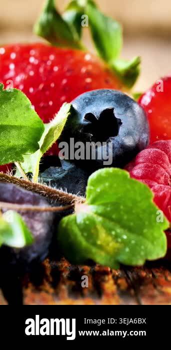 close up of fresh organic berries with strawberry, blueberry and ...