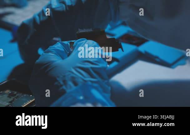 close up of scientist in protective gloves holding microscopic board ...