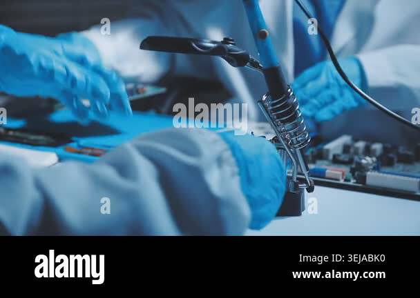 close - up of technician in protective suit working with a microscope ...