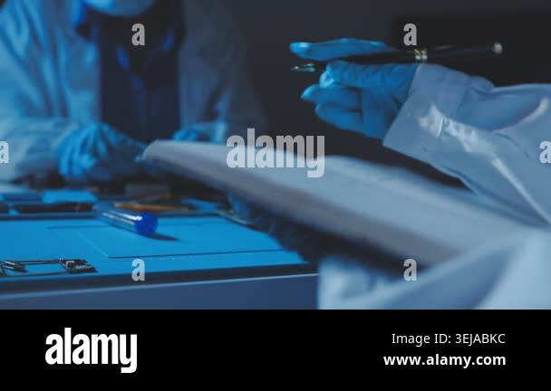 close up of a doctor in protective suit working on his laptop Stock ...