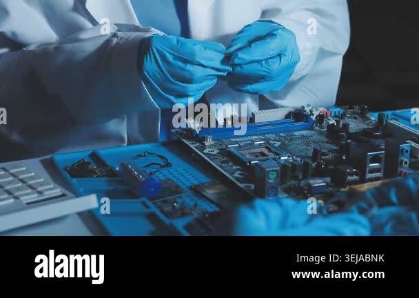 close up view of computer technician holding microchip in computer ...