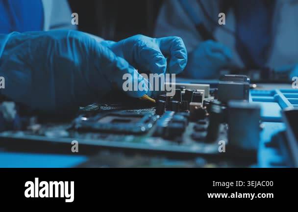close - up of the technician repairing a computer computer with a ...