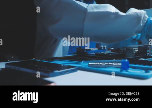 technician holding a computer in his hands while fixing the computer ...