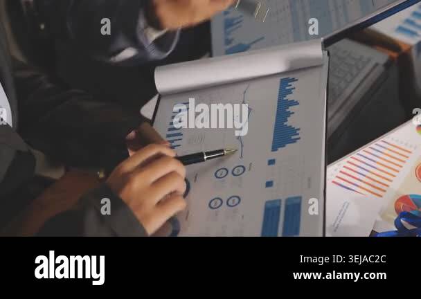 businesswoman working in office with graph chart. business man working ...