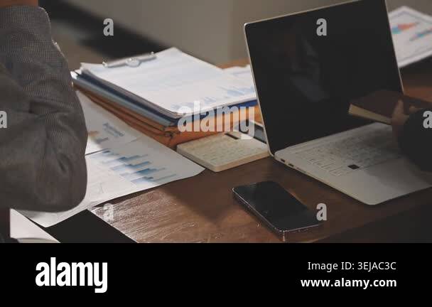 business team discussing financial data on computer Stock Video Footage ...