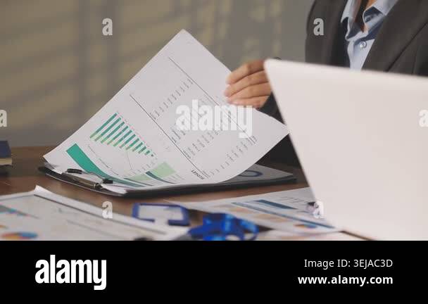 businessman working with financial documents and laptop Stock Video ...