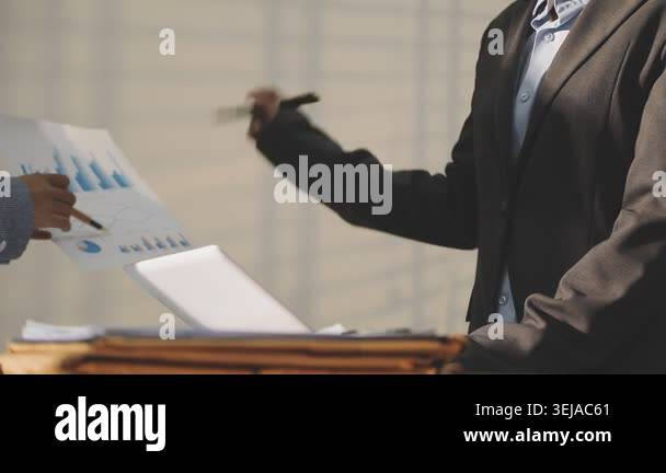 young man in suit holding a pen and writing in the notebook Stock Video ...