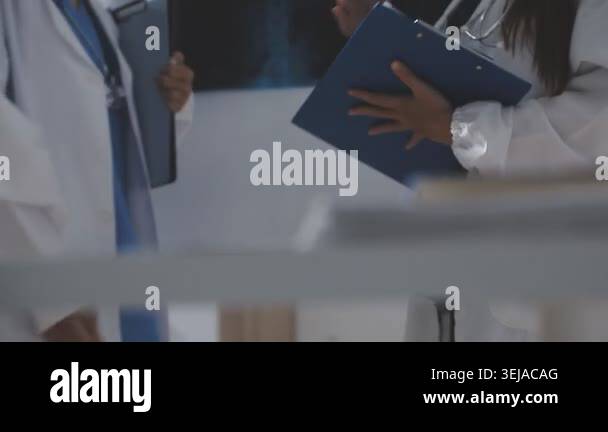 young doctor holding x - ray of hand Stock Video Footage - Alamy