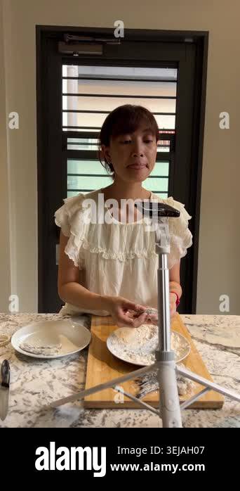 Happy calm asian woman food influencer recording daily cooking vlog ...