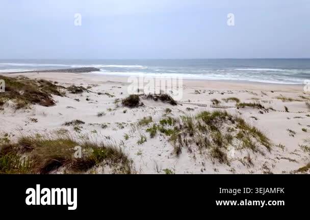 A wide-angle aerial shot captures the serene, overcast atmosphere over ...
