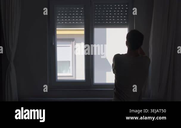 Close up of hand closing blinds in dark room, emotional isolation and ...