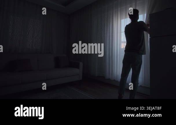 Morning routine opening blinds with natural sunlight in cozy apartment ...
