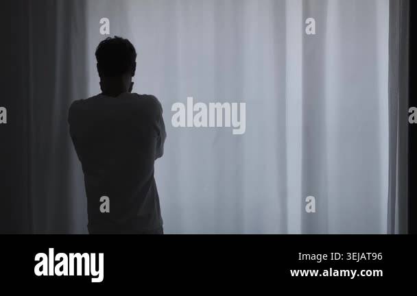 Emotional burnout in temporary rented apartment with silhouette man ...