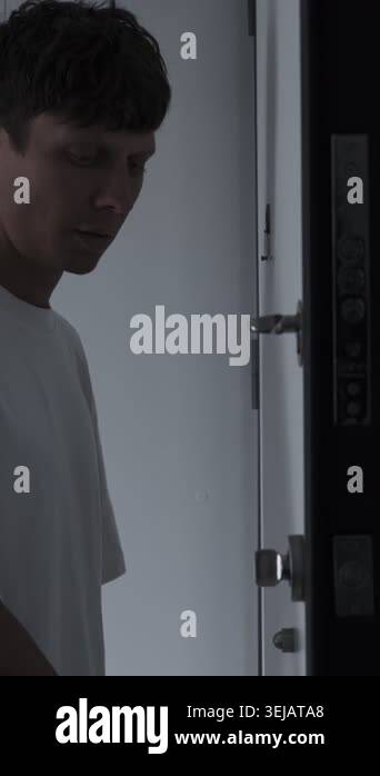 Agoraphobia and paranoia concept with frightened man quickly locking ...