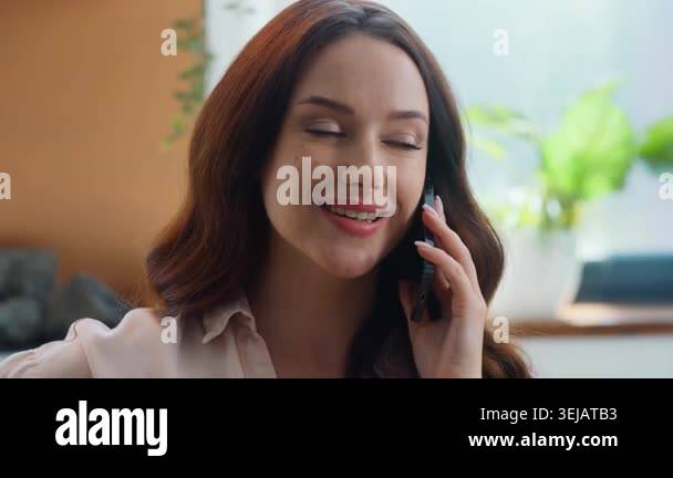 Close up happy smiling Caucasian business woman talking mobile phone ...