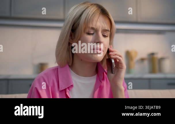 Confused puzzled Caucasian teen girl woman at home apartment talking ...