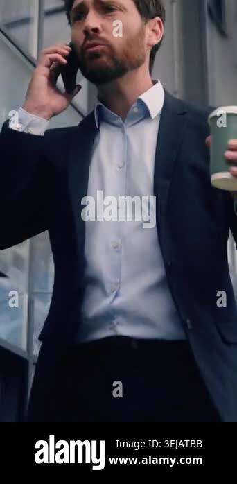 Angry middle aged Caucasian business man arguing mobile phone outside ...