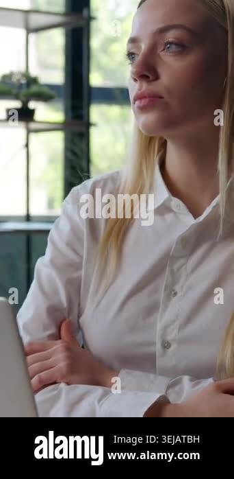 Serious thinking Caucasian businesswoman at office table pondering ...