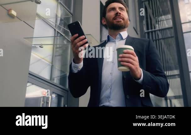 Happy middle aged Caucasian business man walking city office holding ...