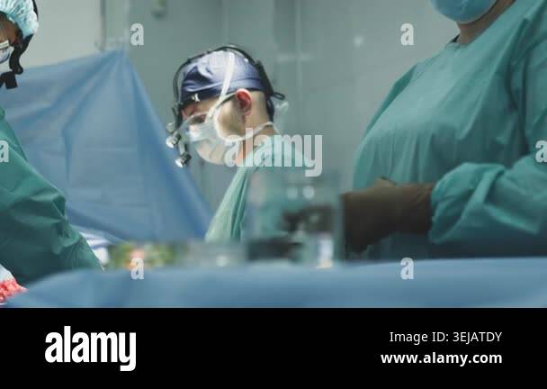 Group doctors skilled surgeons practitioners perform operation surgical ...