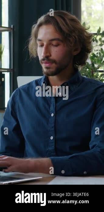 Arabian eastern business man typing laptop looking at camera calm ...