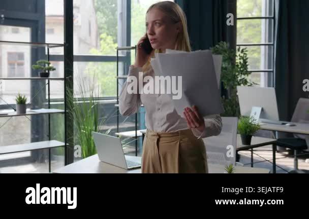 Angry aggressive Caucasian businesswoman screaming talking mobile phone ...