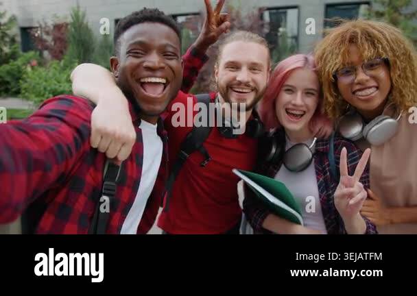 Web cam view four multiracial university students happy smiling cuddle ...