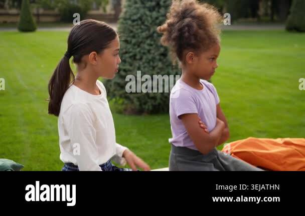 Offended little girls African American friends children quarrel problem ...