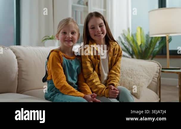 Portrait two happy Caucasian sisters siblings smiling joyful relaxing ...