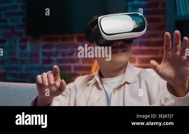 Happy smiling Asian man playing virtual reality game smile Korean male ...