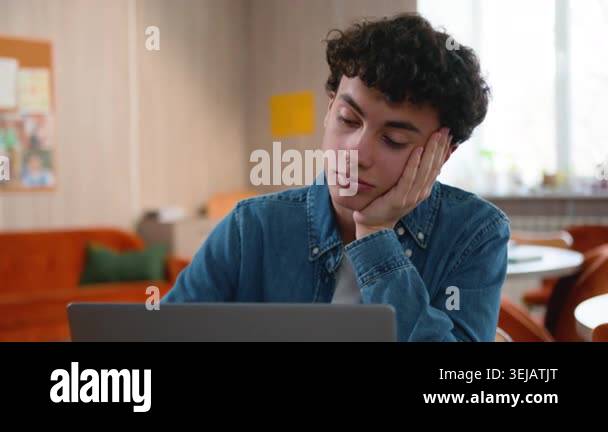 Caucasian tired bored male student fatigued boy in school studying ...