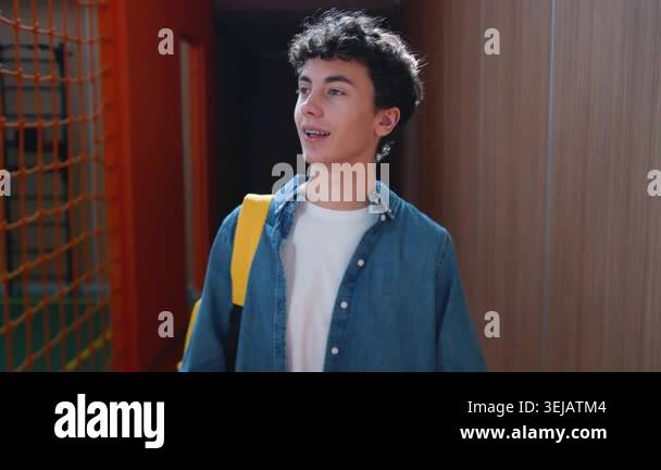 Caucasian happy student guy school boy walking in sport hall university ...