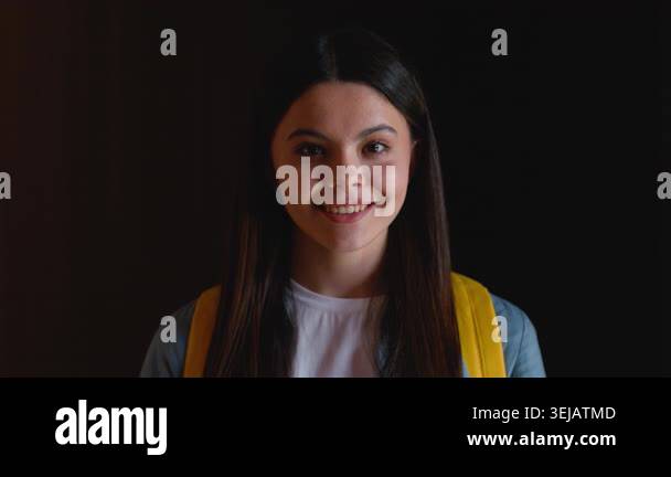 Portrait happy Caucasian student girl teen in school looking at camera ...