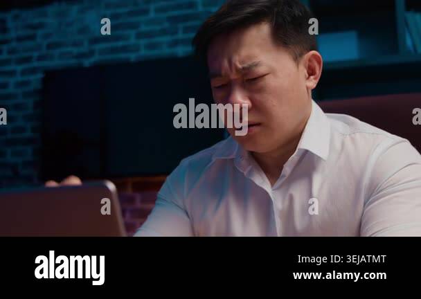 Ill sick unhealthy Asian business man working laptop feeling headache ...