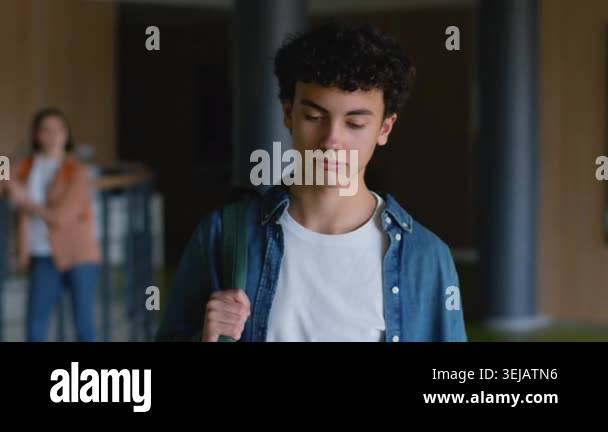 Caucasian guy pupil student going in school upset bullying boy pushing ...
