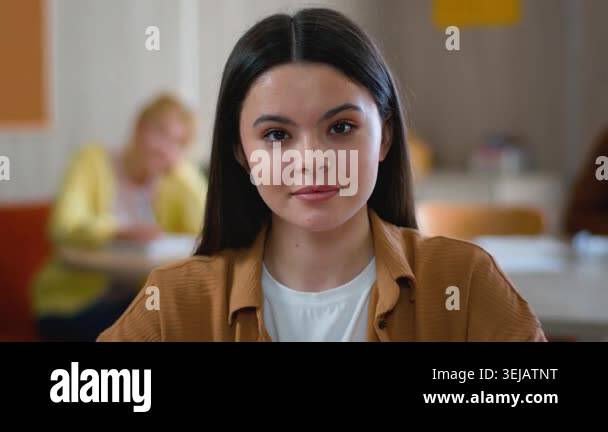 Smiling Caucasian pupil student female girl portrait looking at camera ...
